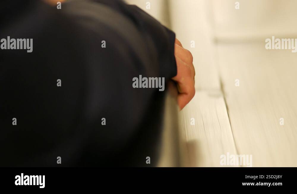 Closeup of a two passengers hands lifting on escalator handrail. Human ...