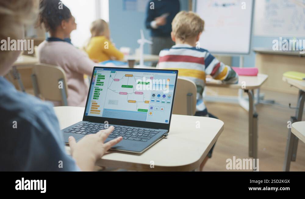 Elementary School Science Class: Little Boy Uses Laptop Programming ...