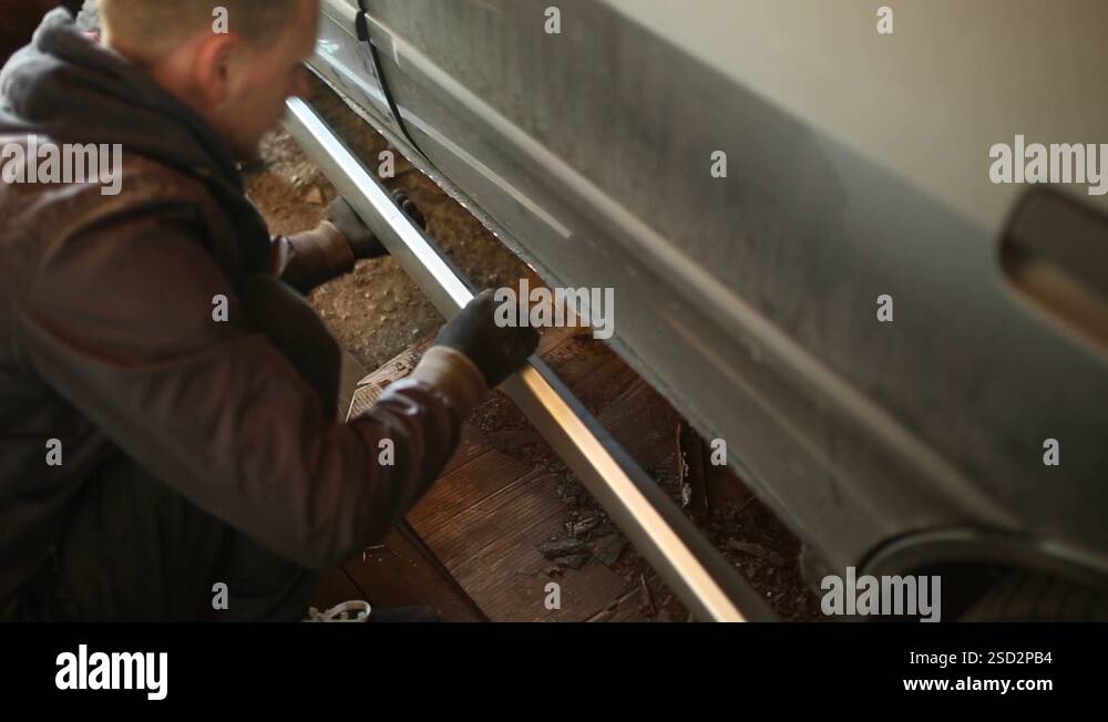 car body repair. Replacing the metal threshold with galvanized Stock ...