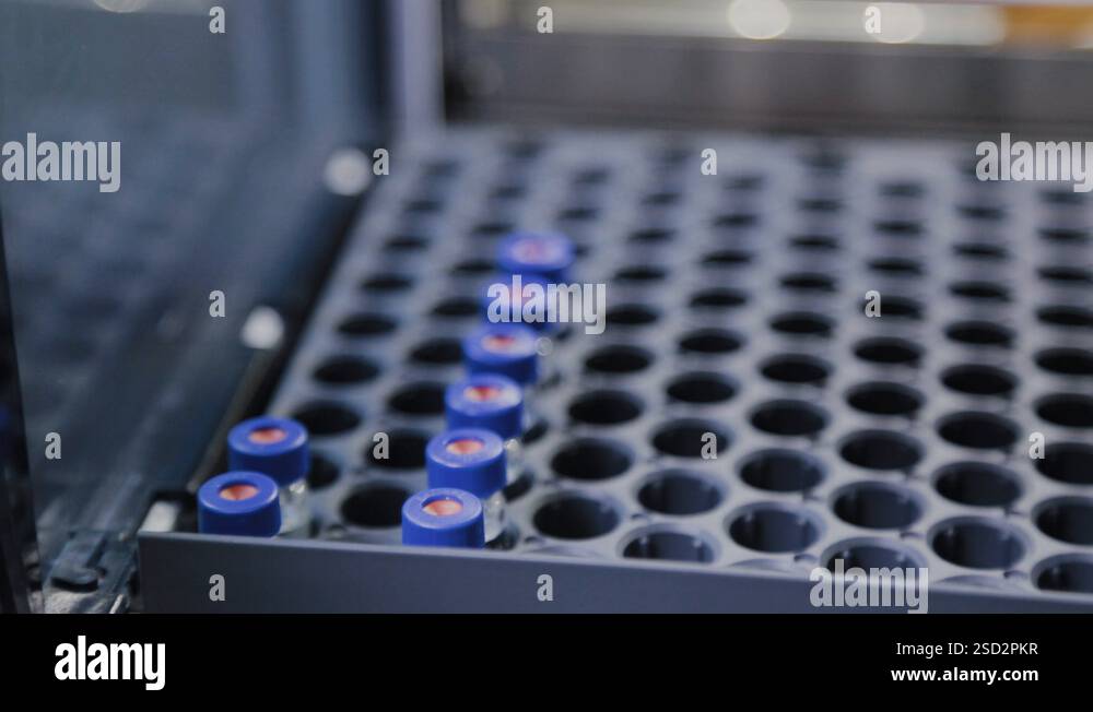An analyzer works in the laboratory to study the composition of the ...