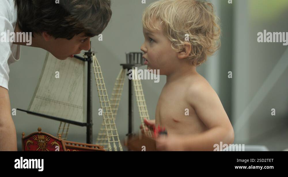 Infant baby boy not wanting other children to play with his toys. Baby ...