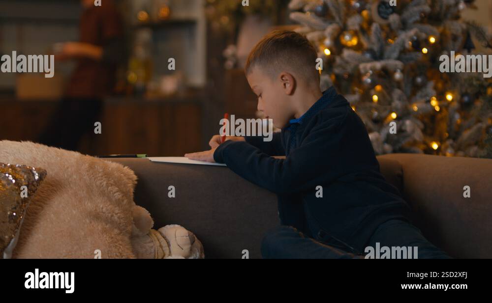 Cute little Caucasian kid boy writing a letter to Santa Claus Stock ...