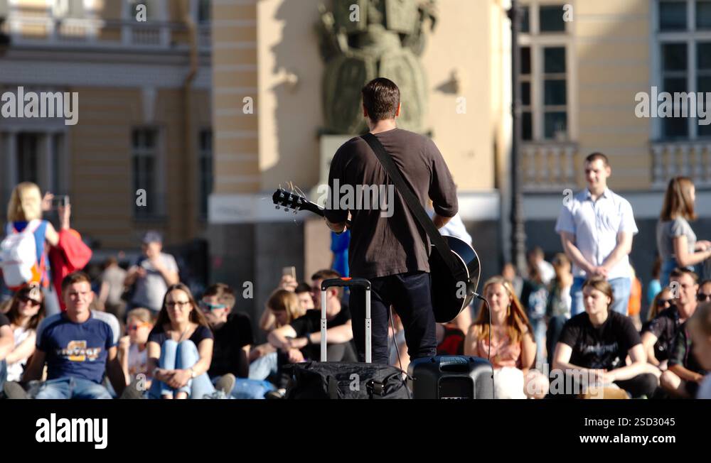 Young singer sings on the Palace Square - back view Stock Video Footage ...