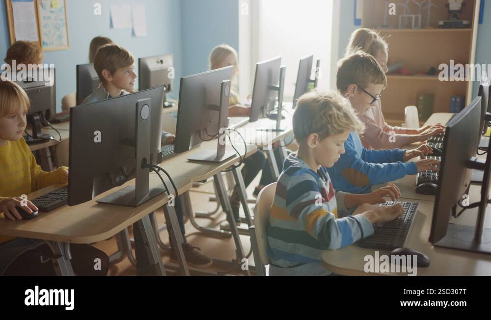 School Computer Classroom: Diverse Group of Little Smart Schoolchildren using PC Stock Video ...