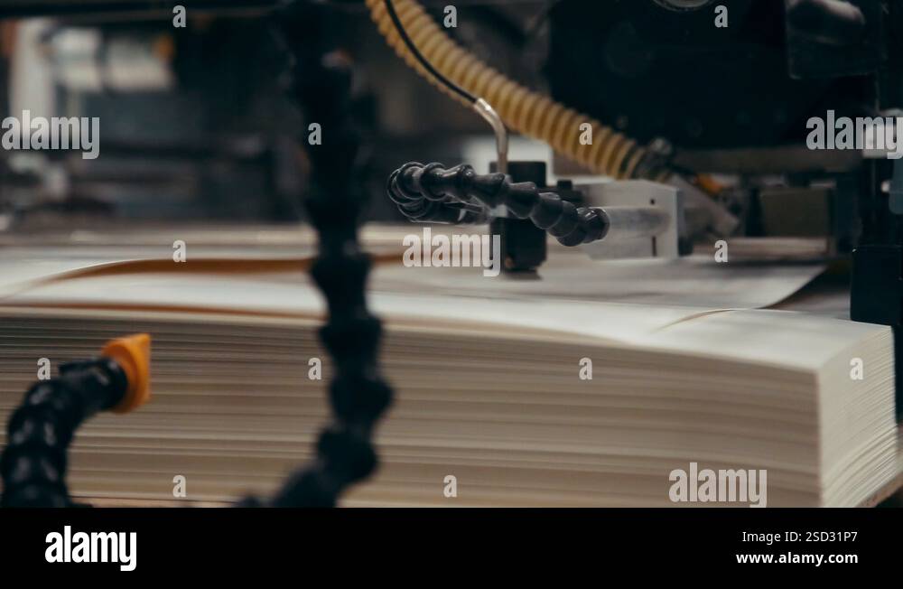 Print plant factory. Newspaper printing at a plant. Paper printed on a ...
