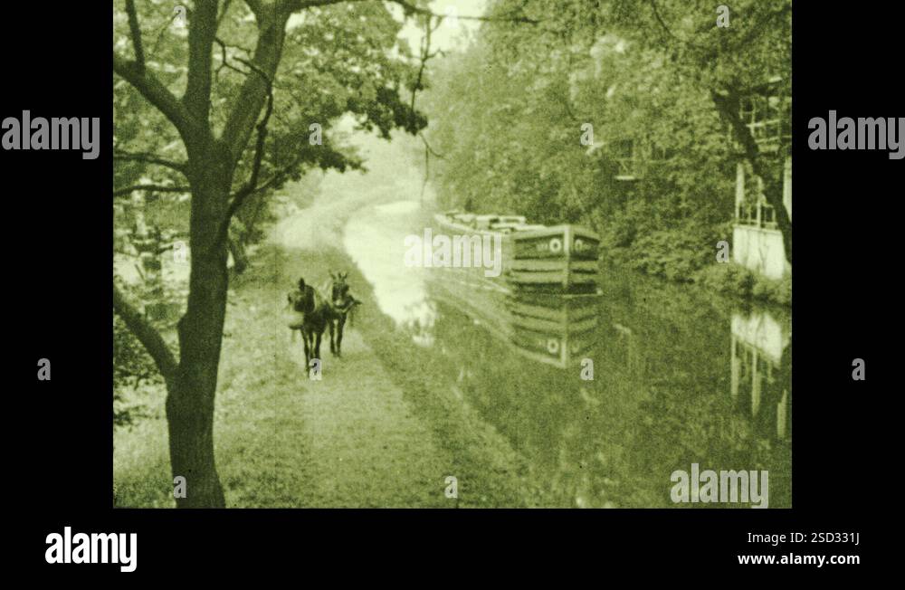 1930s: Two mules pull a barge down the Erie Canal. Commemorative sign ...