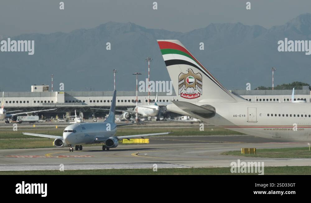 ASL Aviation Boeing 737-48E airplane on the Malpensa airport runway ...