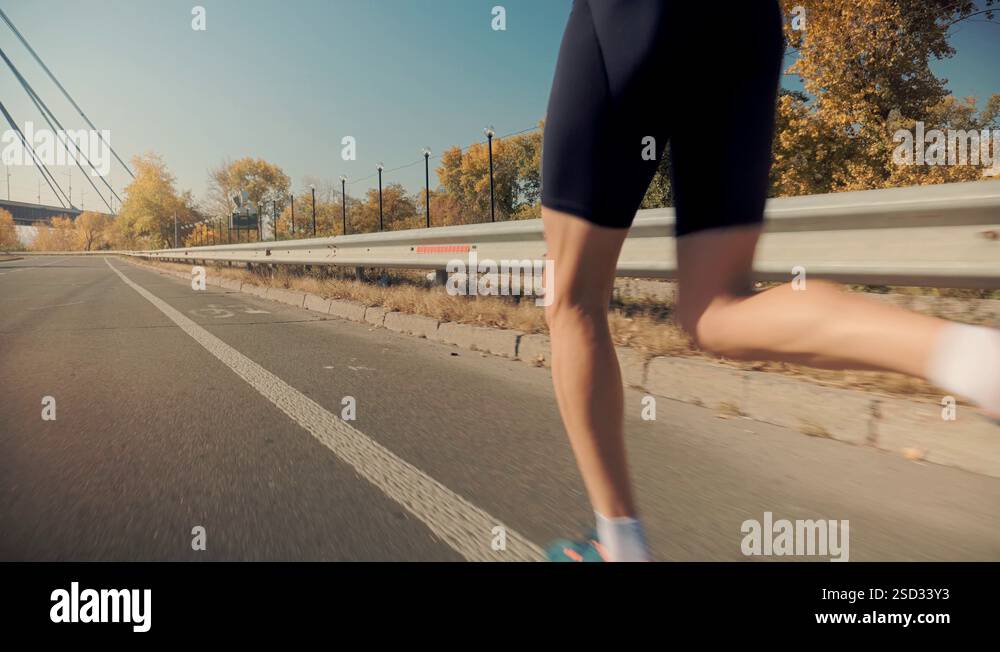 Runner Athlete Legs Running And Jogging.Triathlon Triathlete Running ...