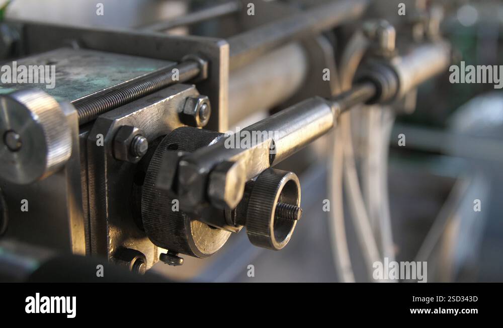 Metallic rod moving back and forth on conveyor stripe in tomato ...