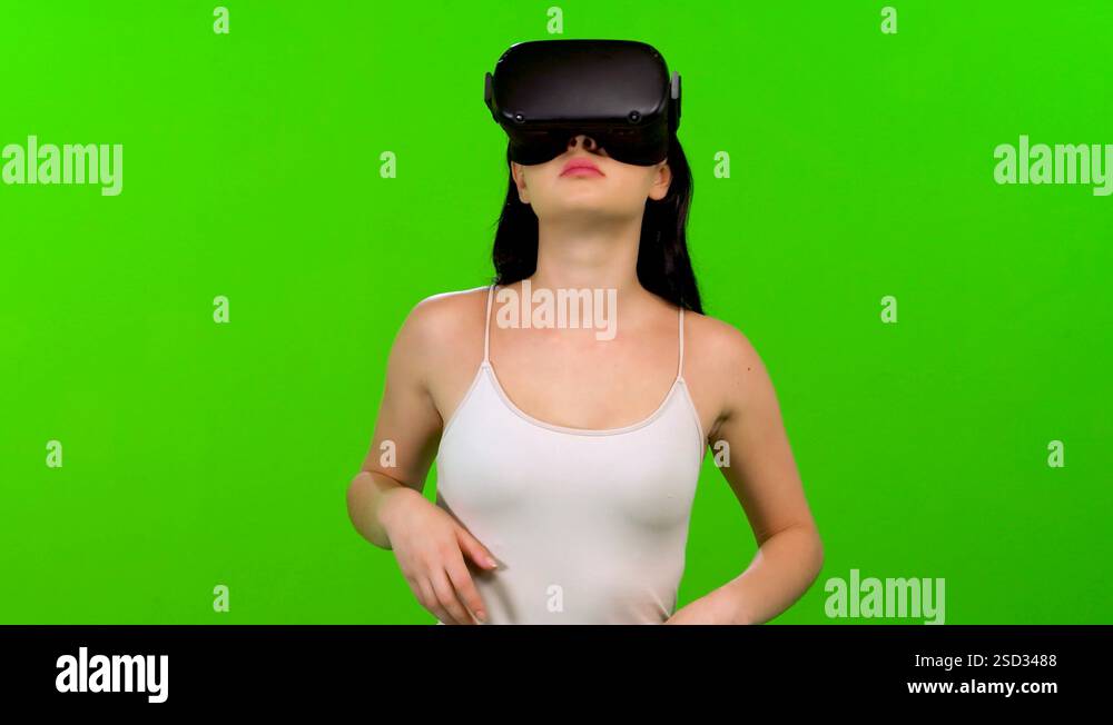 Various gestures in a VR app by a teenager over green screen Stock ...