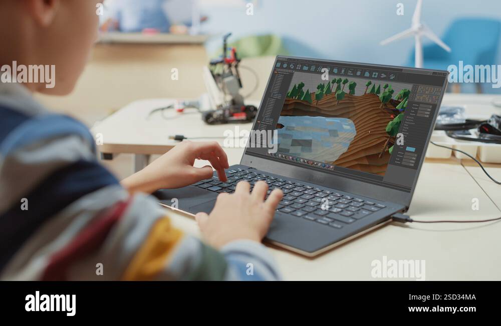 Elementary School Computer Science Classroom: Kid Using Laptop to ...