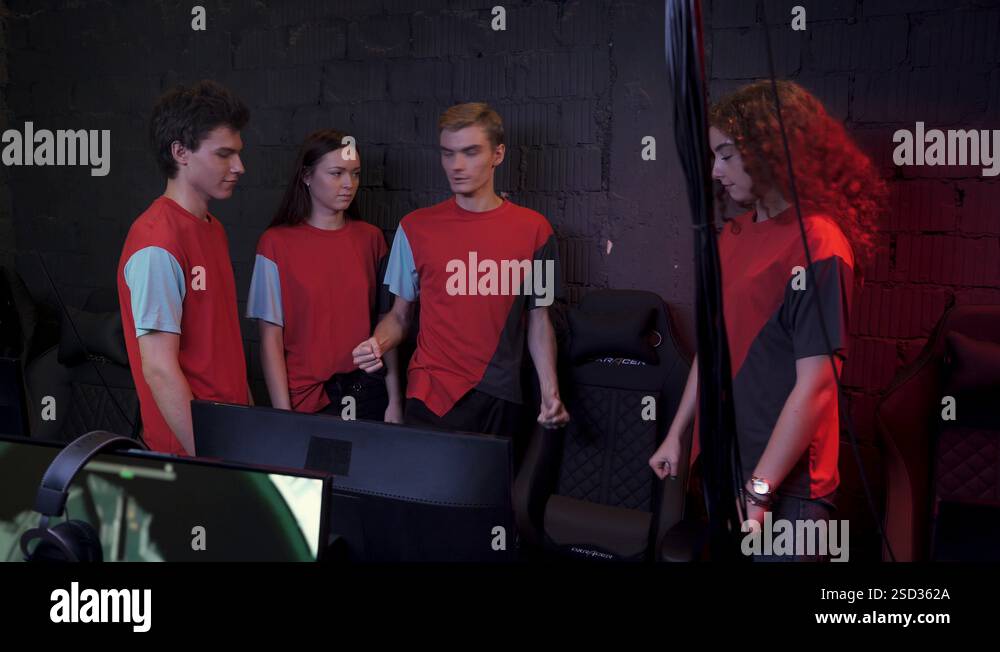 Young gamers stacked hands together one by one before the competition ...