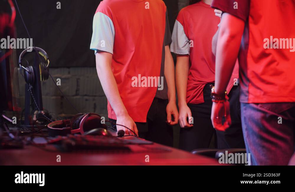 Young gamers stacked hands together one by one before the competition, cyber Stock Video Footage ...