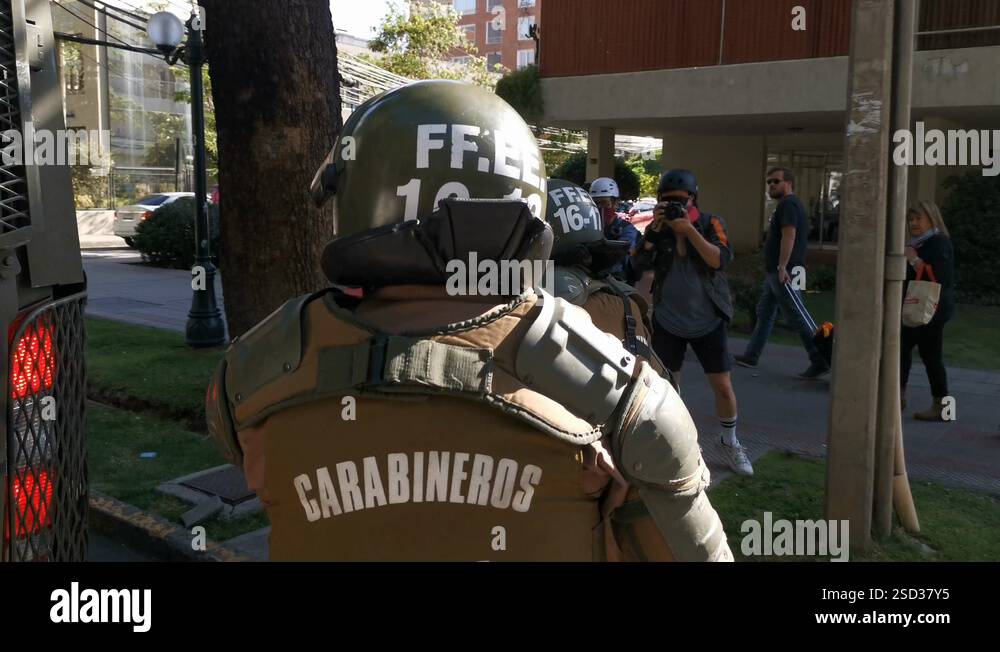 The police arresting one protester during latest riots in Santiago city ...