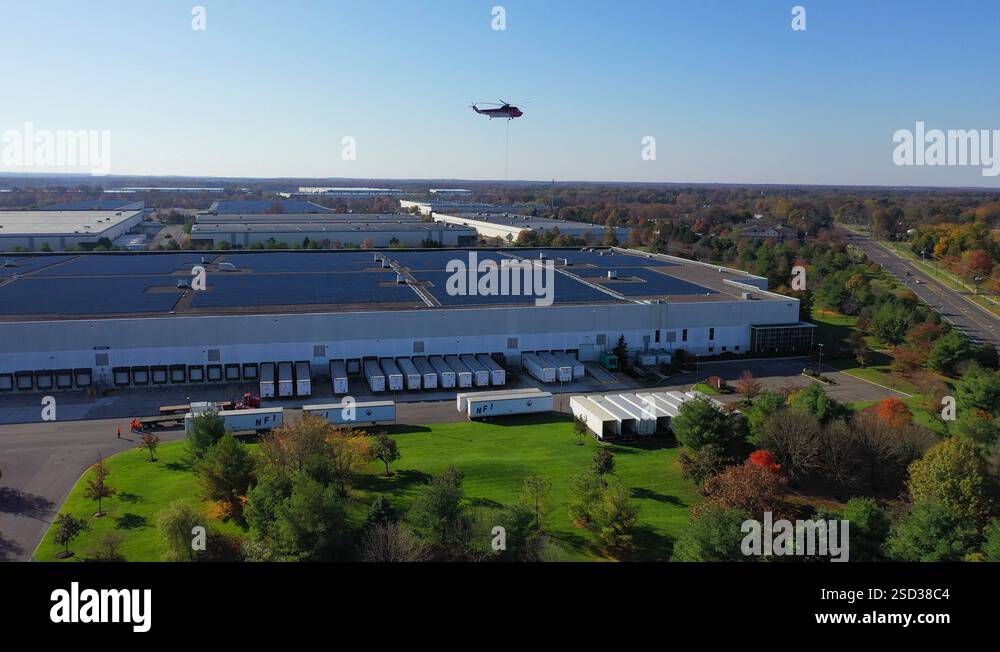View of a Heavy Lift Helicopter Flying Over a Large Commercial ...