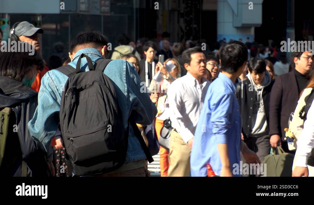 TOKYO, JAPAN : Crowd of people at Shibuya Scramble Crossing. Slow ...
