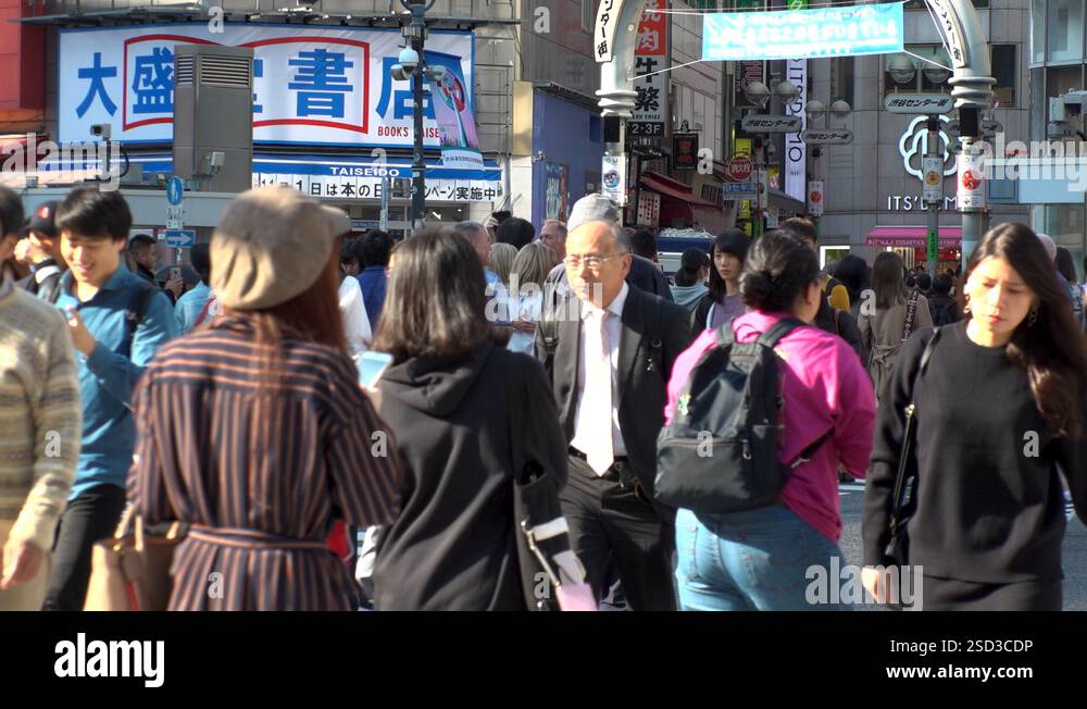 TOKYO, JAPAN : Crowd of people at Shibuya Scramble Crossing. Slow ...