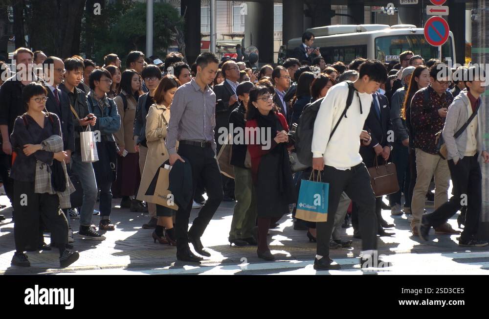 TOKYO, JAPAN : Crowd of people at Shibuya Scramble Crossing. Slow ...