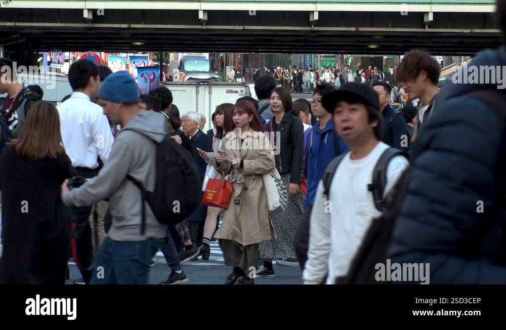 TOKYO, JAPAN : Crowd of people at Shibuya Scramble Crossing. Slow ...