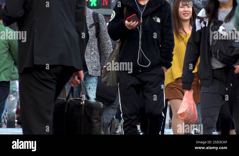 TOKYO, JAPAN : Crowd of people at Shibuya Scramble Crossing. Slow ...