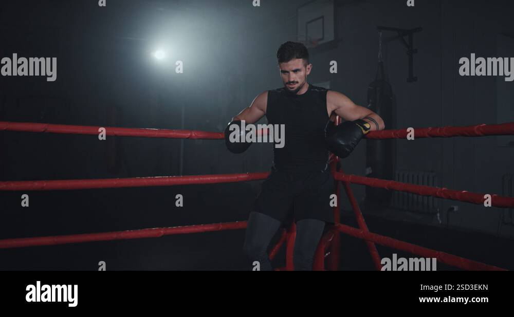 Great looking guy in a boxing ring have a break between his boxing ...
