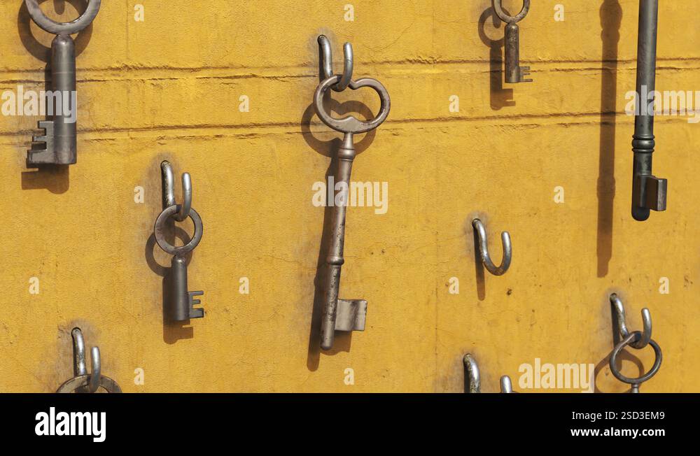 Animation of a key hanging on the hook with other keys around. Yellow ...
