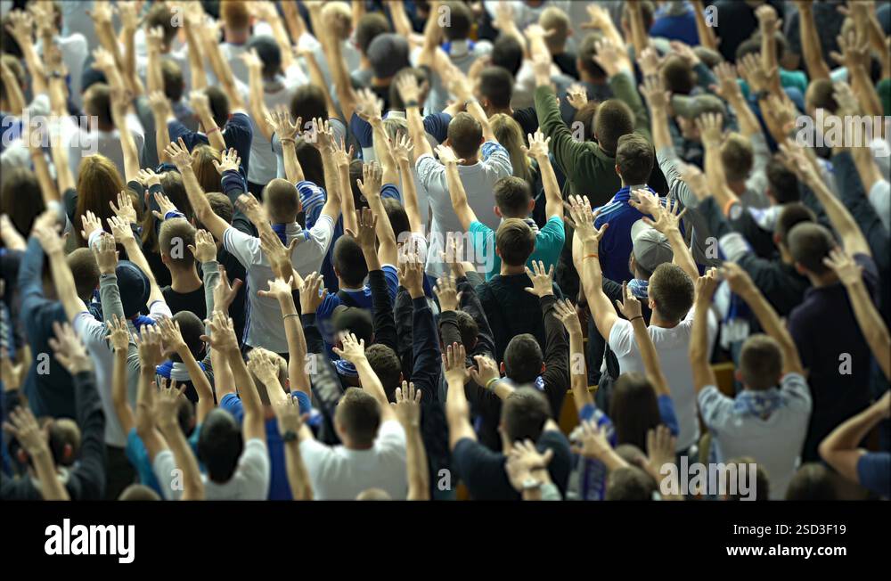 Soccer football fans creating wave with hands, showing support for team ...