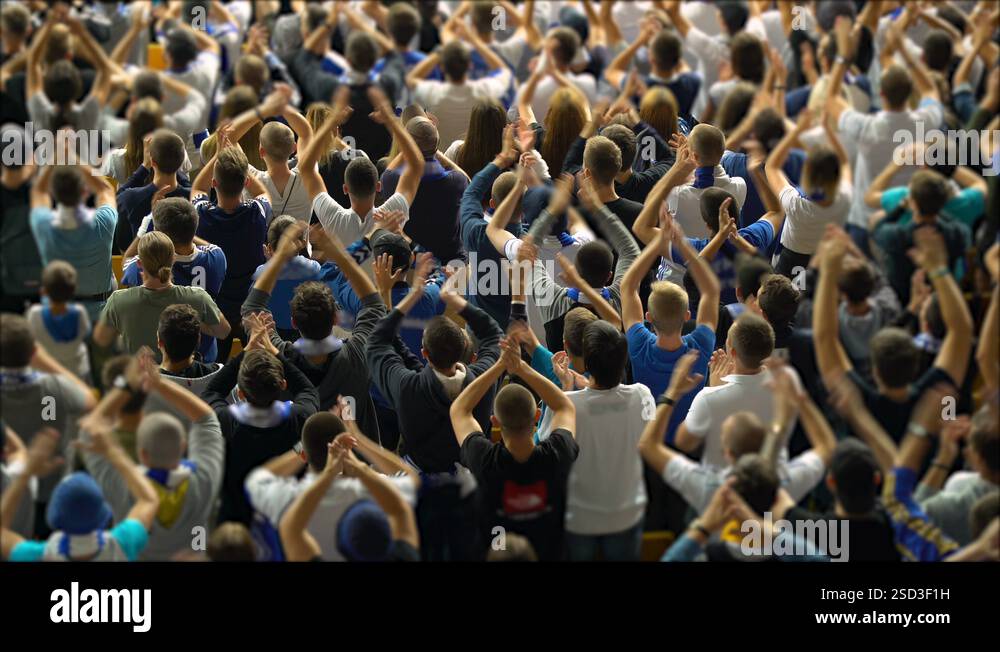 Crowd of football soccer fans cheering unanimously, mass control ...