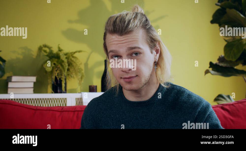 Positive handsome blonde guy showing hand gesture shaka sign ...