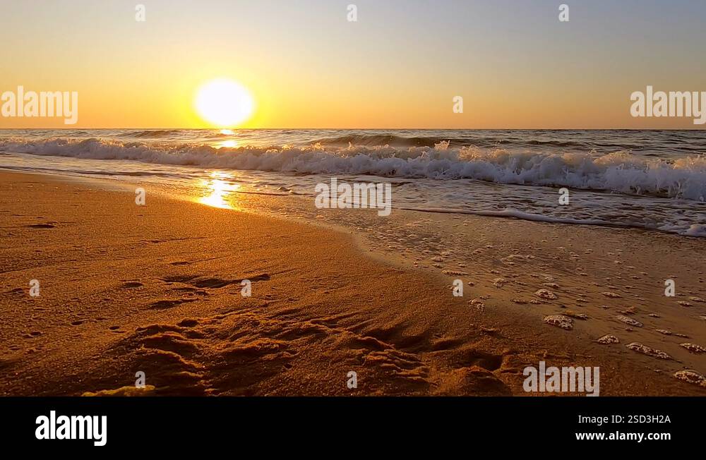 Sunset sunrise dawning at sea ocean. Water and waves sea landscape ...