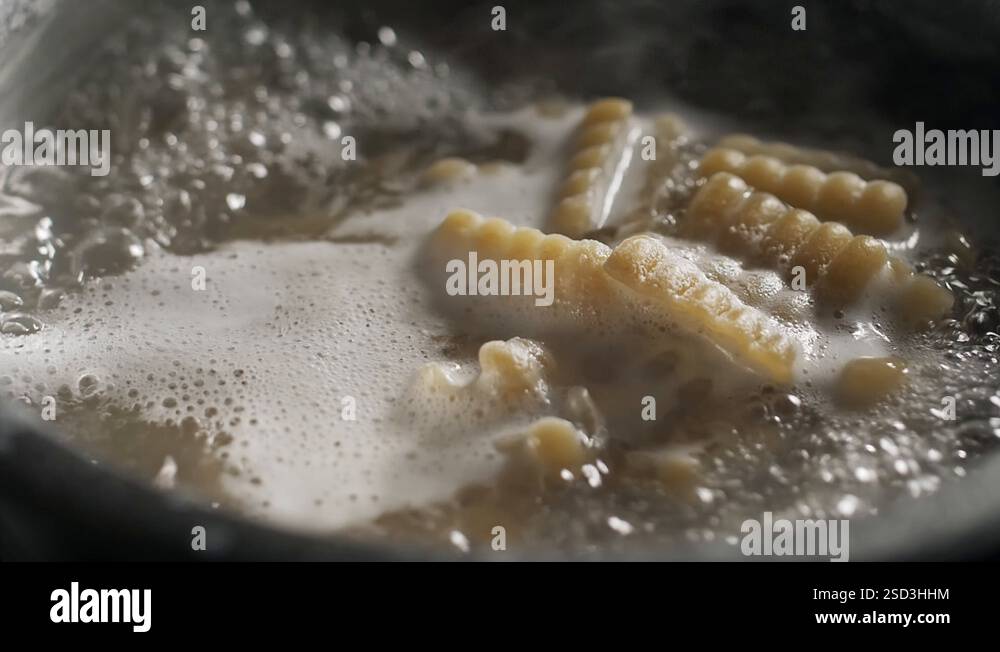 Boiling Twirly Pasta For The Recipe Pasta With Bolognese Sauce - Slow ...