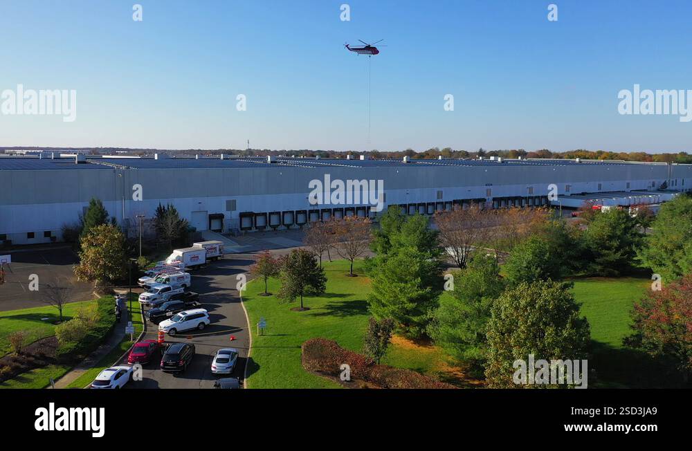 View of a Heavy Lift Helicopter Flying Over a Large Commercial ...