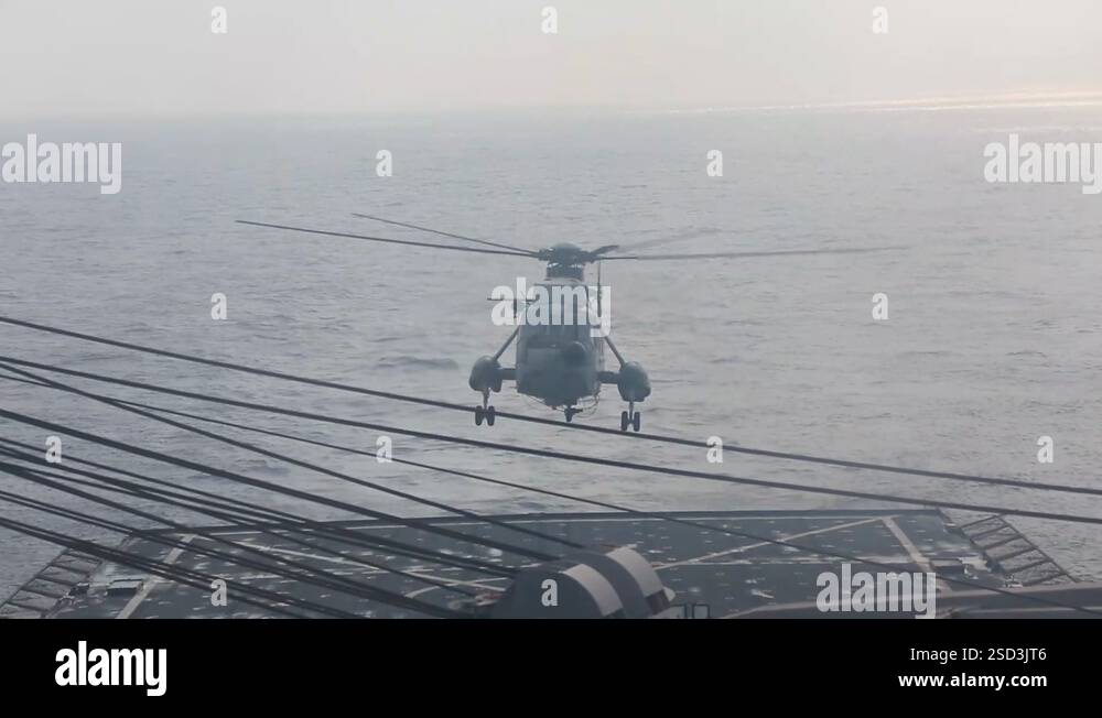 Indian Navy UH-3H Sea King landing aboard USS Germantown in Bay of ...