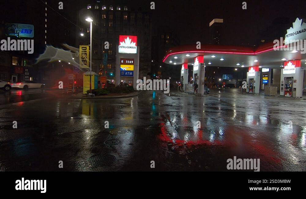 Driving plate rear view POV on a rainy at night on Toronto streets with ...