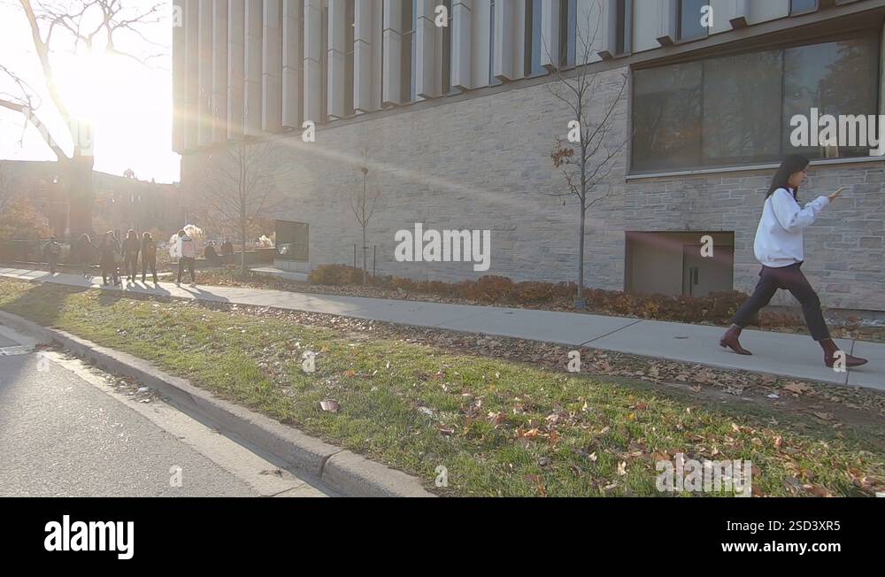 Driving plate side view POV university of Toronto campus with students ...