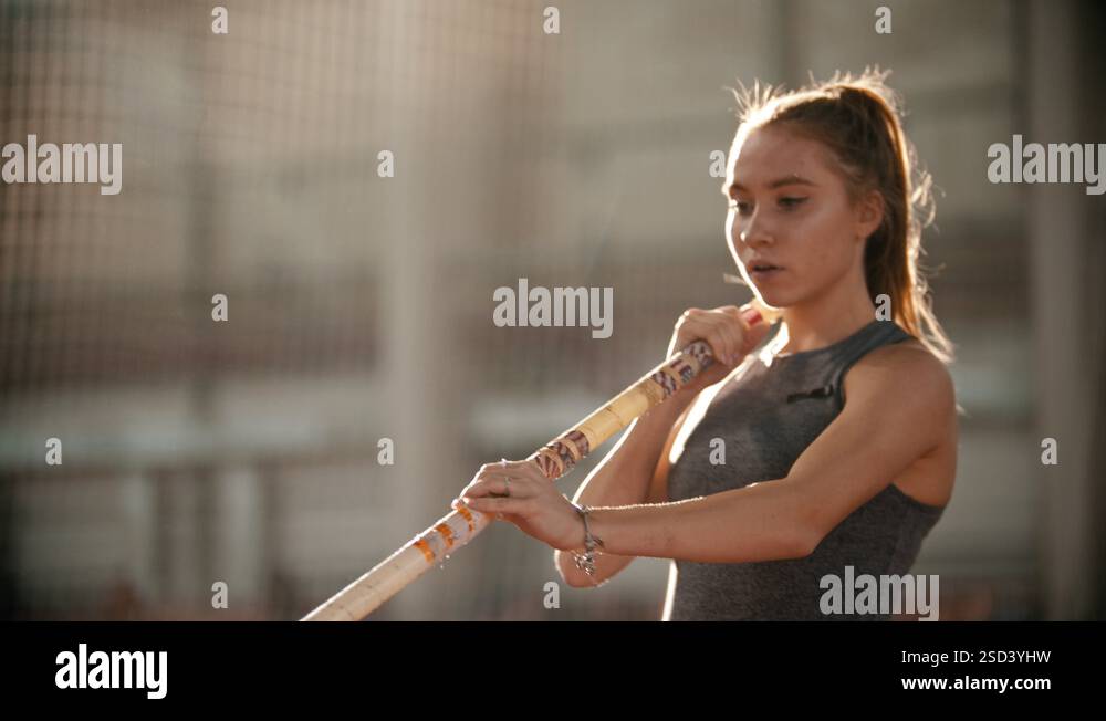 pole vaulting - beautiful athlete is configuring to jump and starting ...