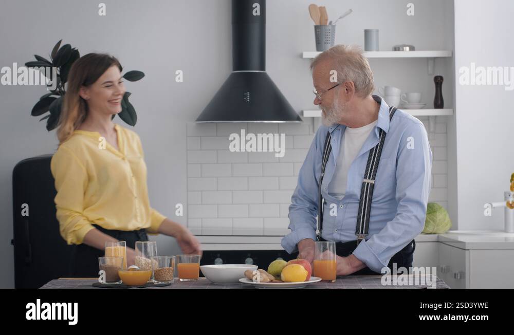 cute elderly man with a beard in glasses for vision has fun with ...