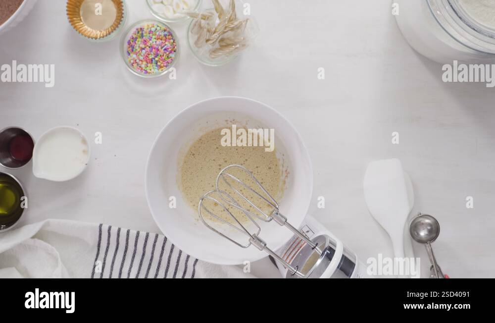 Mixing ingredients together in a white mixing bowl Stock Video Footage ...