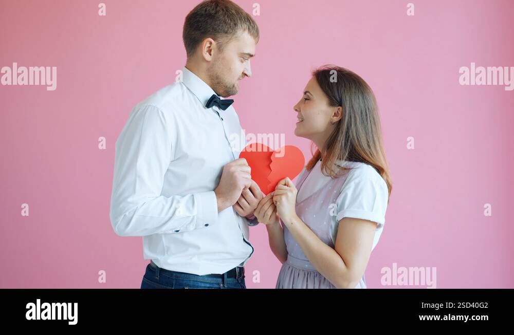 Man and woman holding halves of heart stepping aside expressing ...
