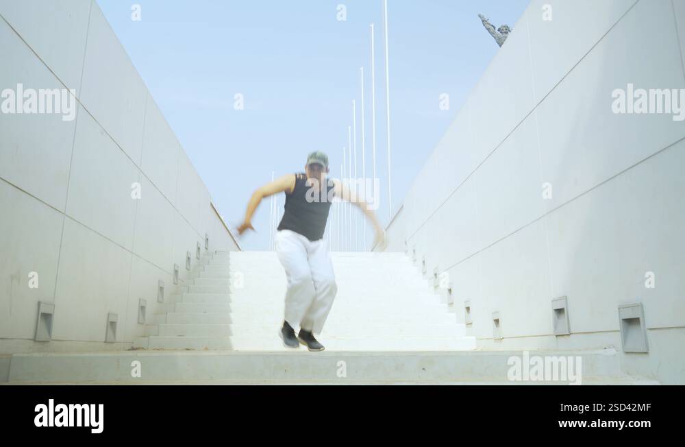 Young man doing hip hop dance on the stair Stock Video Footage - Alamy