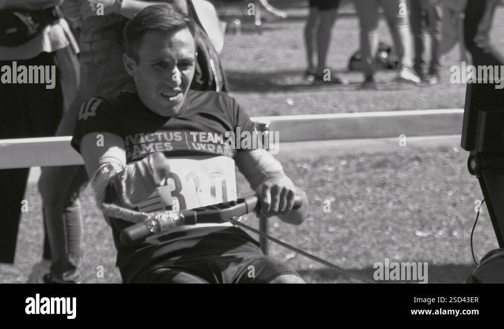 A soldier without a hand on a rowing machine. Competitions among the ...