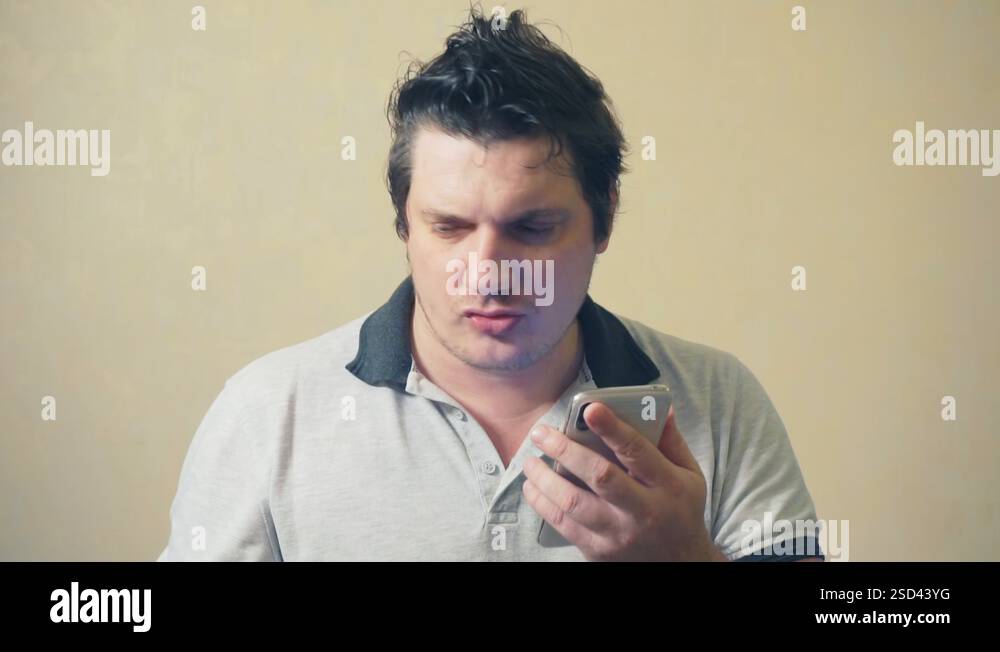 emotional freak with smartphone in hands Stock Video Footage - Alamy