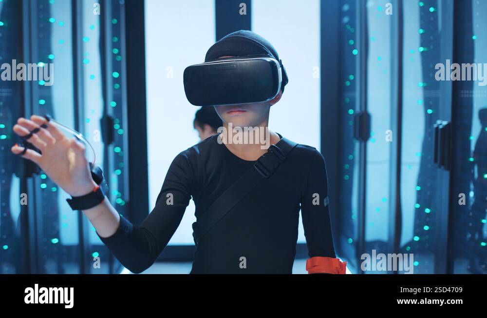 Prodigy spy kid wearing VR headset and robotic exoskeleton hand ...