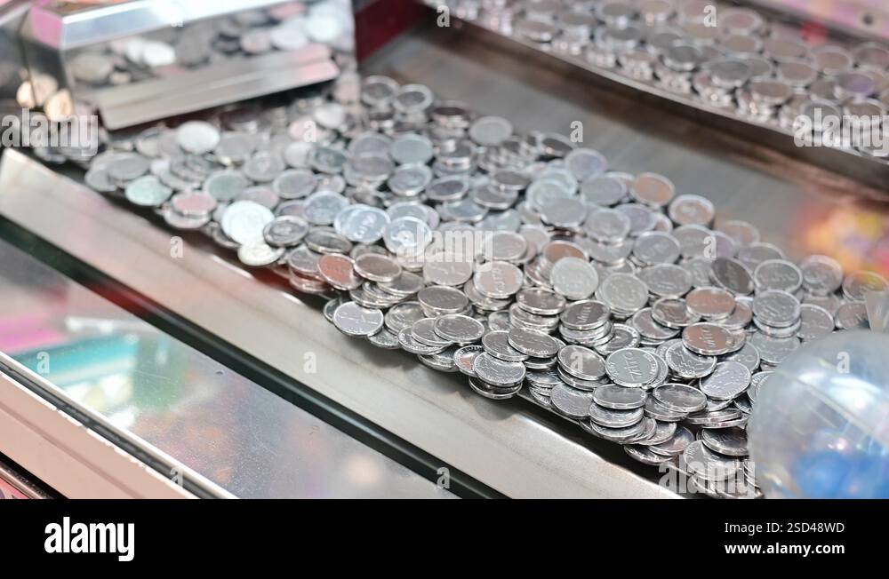 4K Old fashioned arcade money pushing machine Stock Video Footage - Alamy