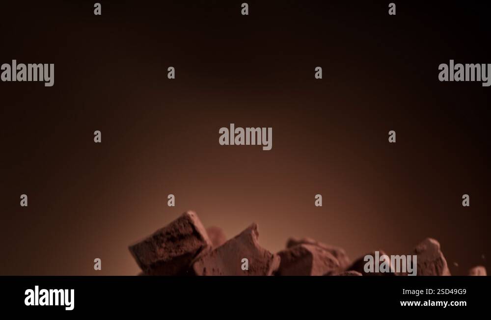 Super Slow Motion Shot of Raw Chocolate Chunks after Being Exploded at ...