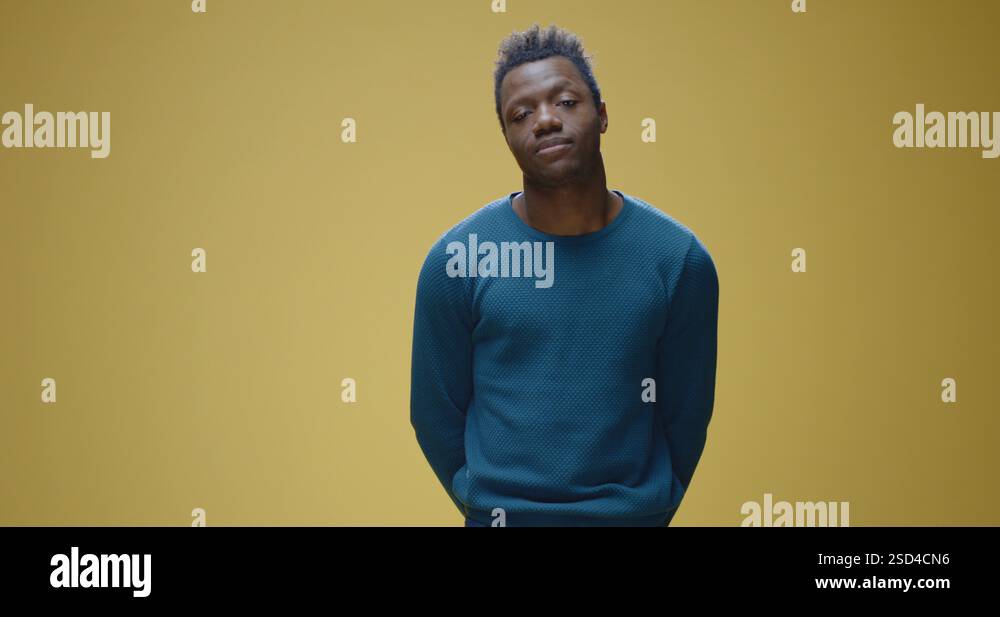 Apathetic man looking at camera Stock Video Footage - Alamy