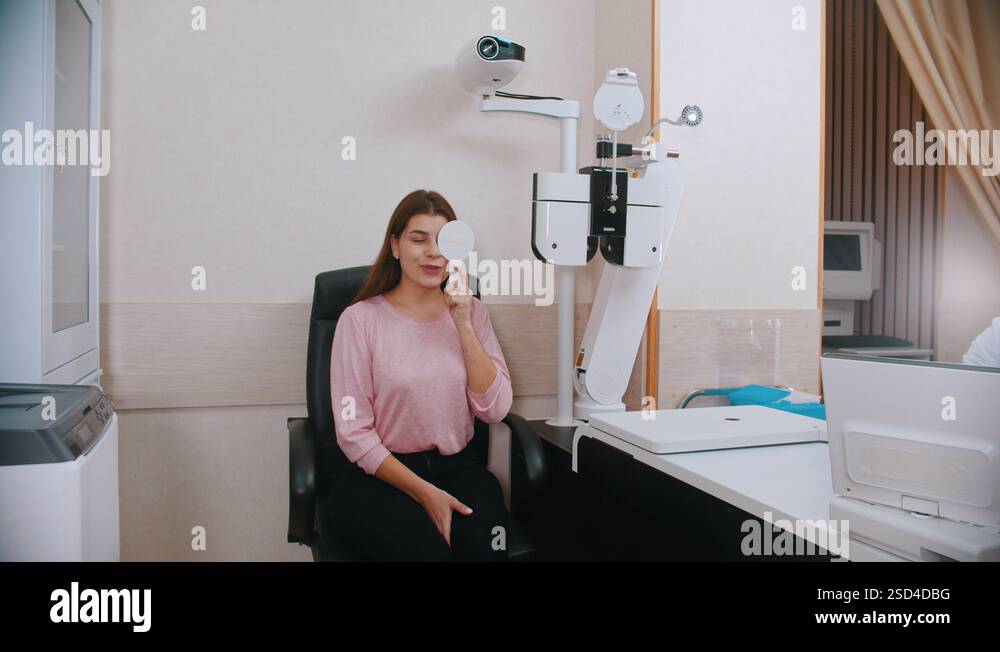 Ophthalmology treatment - young woman checking her visual acuity Stock Video Footage - Alamy