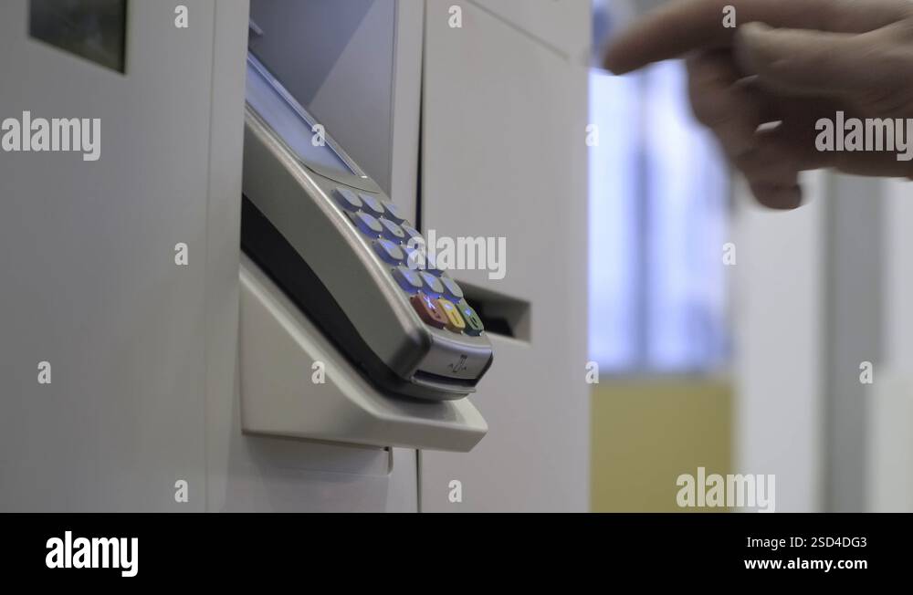 Female hand presses buttons of terminal of payment of purchases closeup ...
