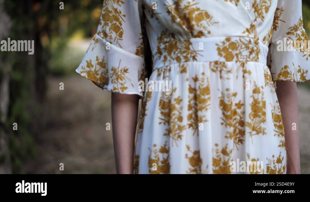 girl with ring on thin finger poses standing in long dress Stock Video ...