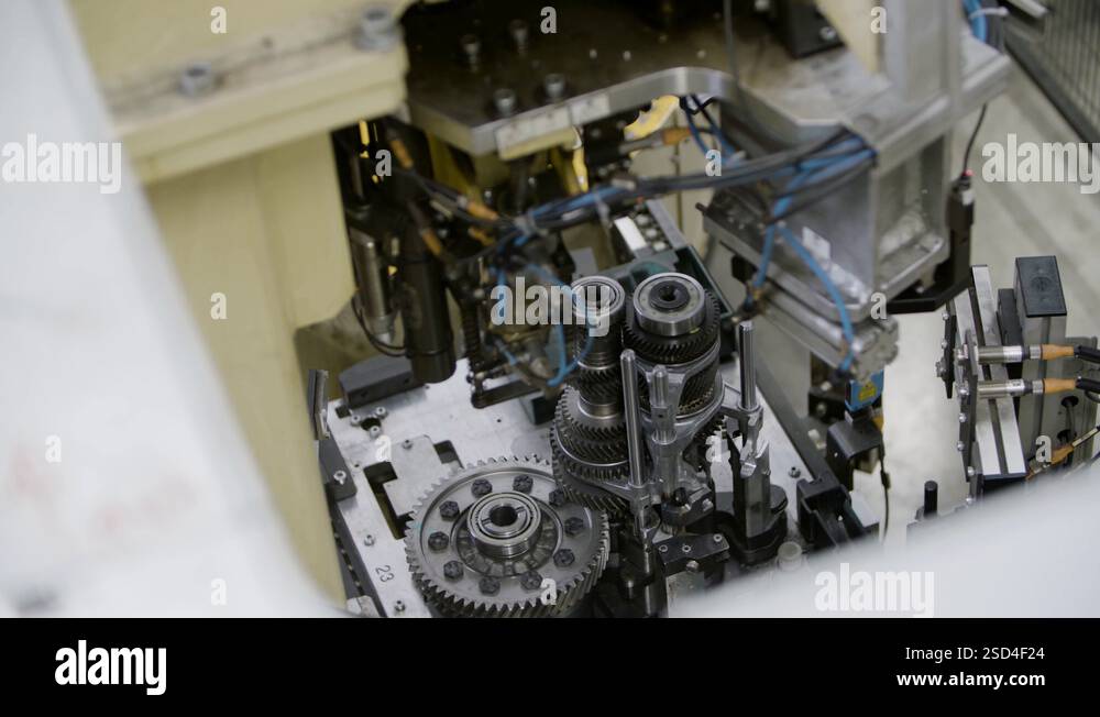 Car engine assembly on the production line. Automobile manufacturing ...